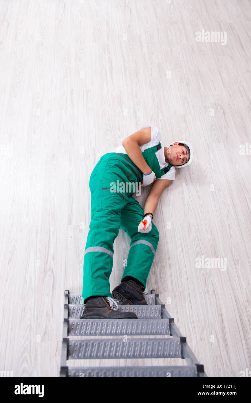Young worker falling from the ladder Stock Photo - Alamy