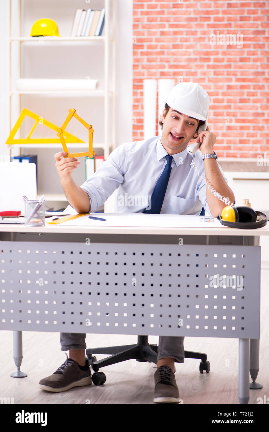 Construction supervisor working on blueprints Stock Photo - Alamy