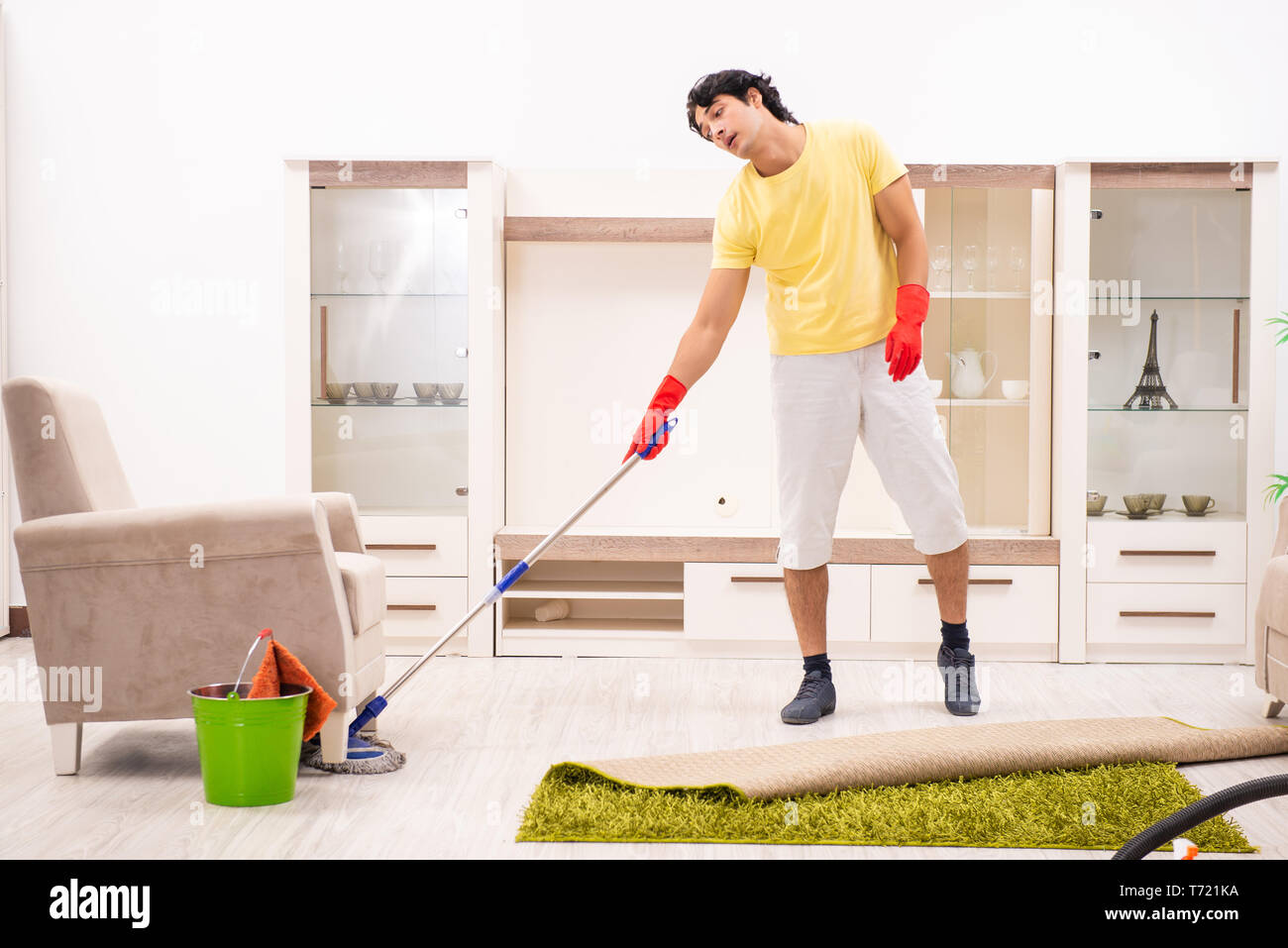 Young handsome man doing housework Stock Photo - Alamy