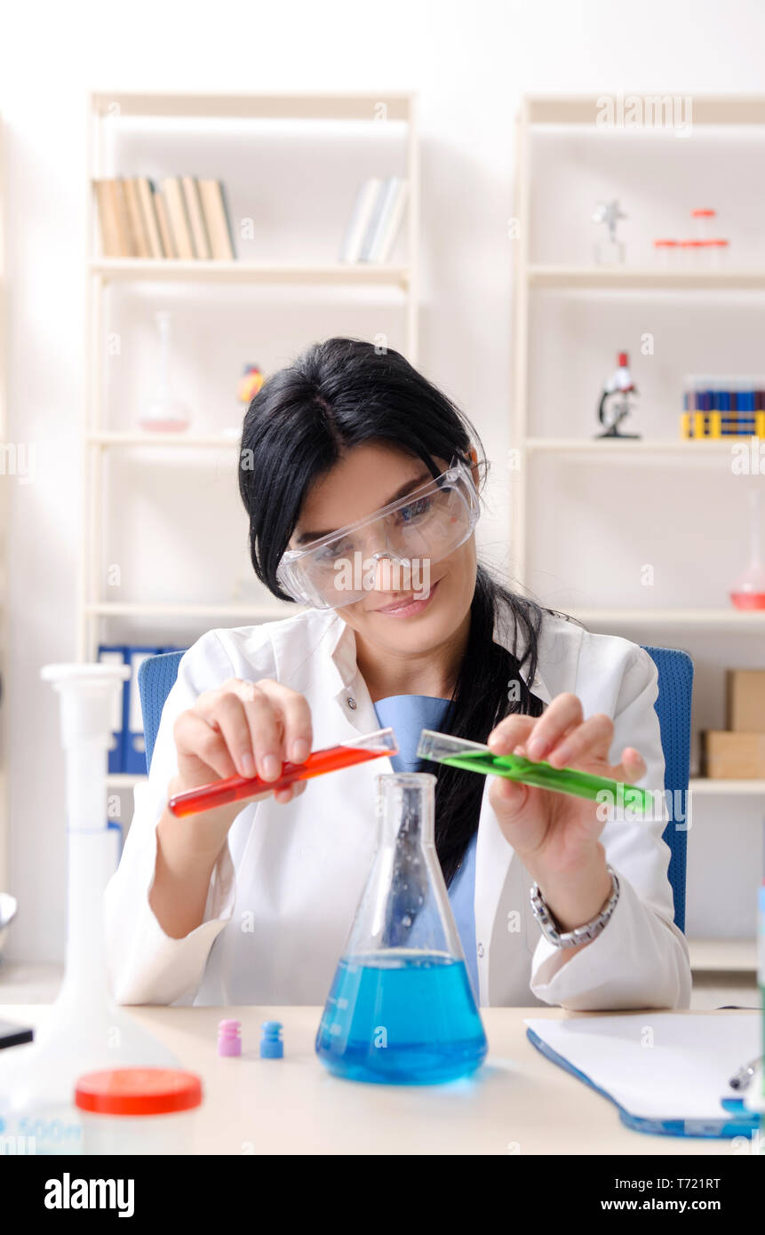 Female chemist working at the lab Stock Photo - Alamy