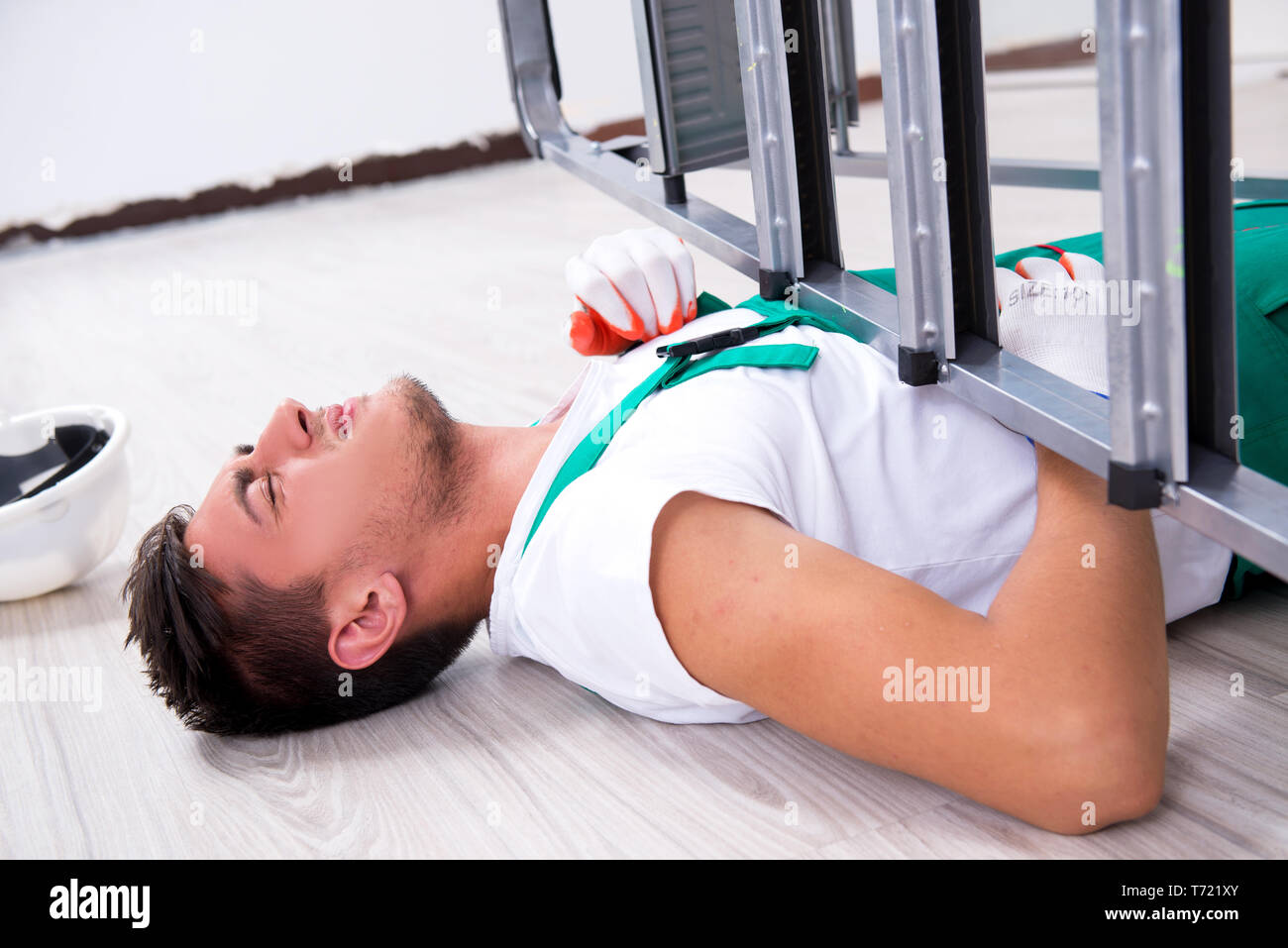 Young worker falling from the ladder Stock Photo - Alamy