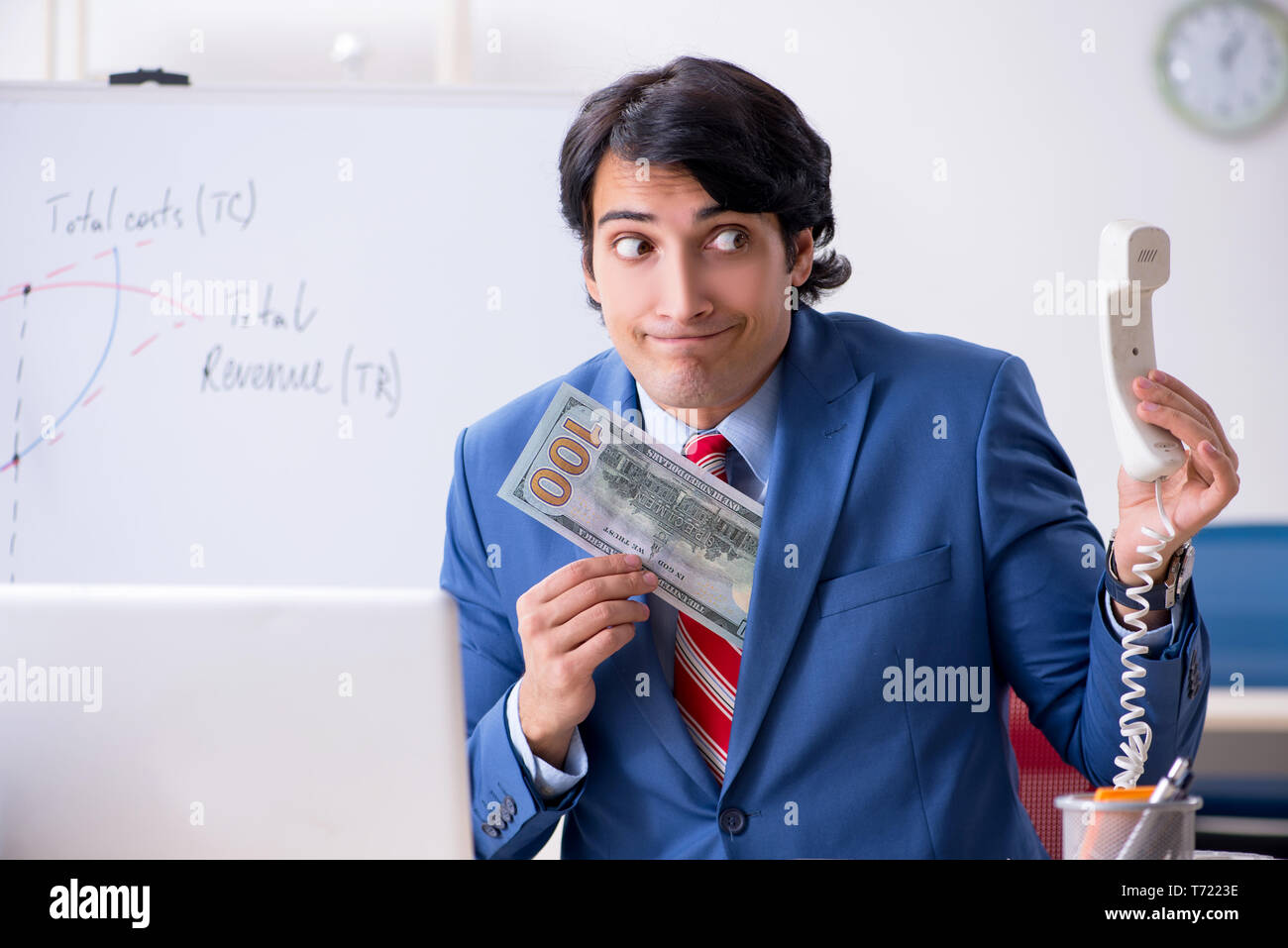 Busy businessman explaining business charts Stock Photo - Alamy
