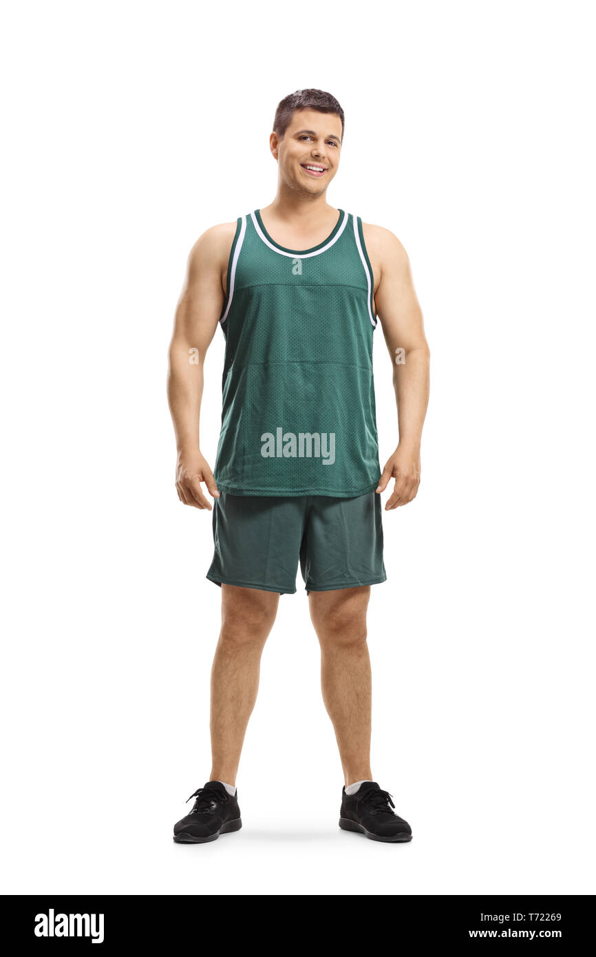 Full length portrait of a male basketball player smiling at the camera ...