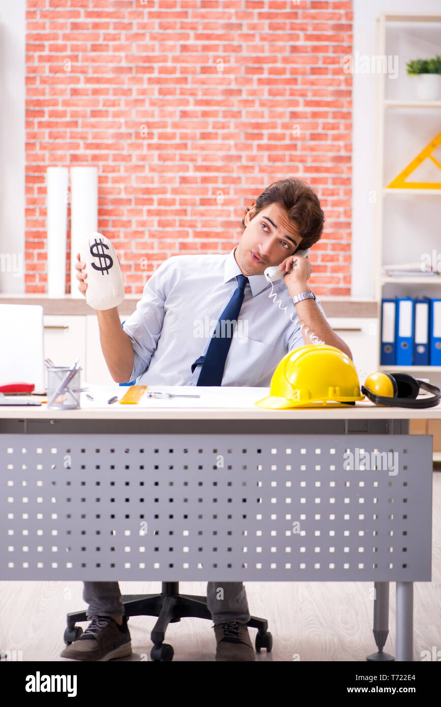 Construction supervisor working on blueprints Stock Photo - Alamy