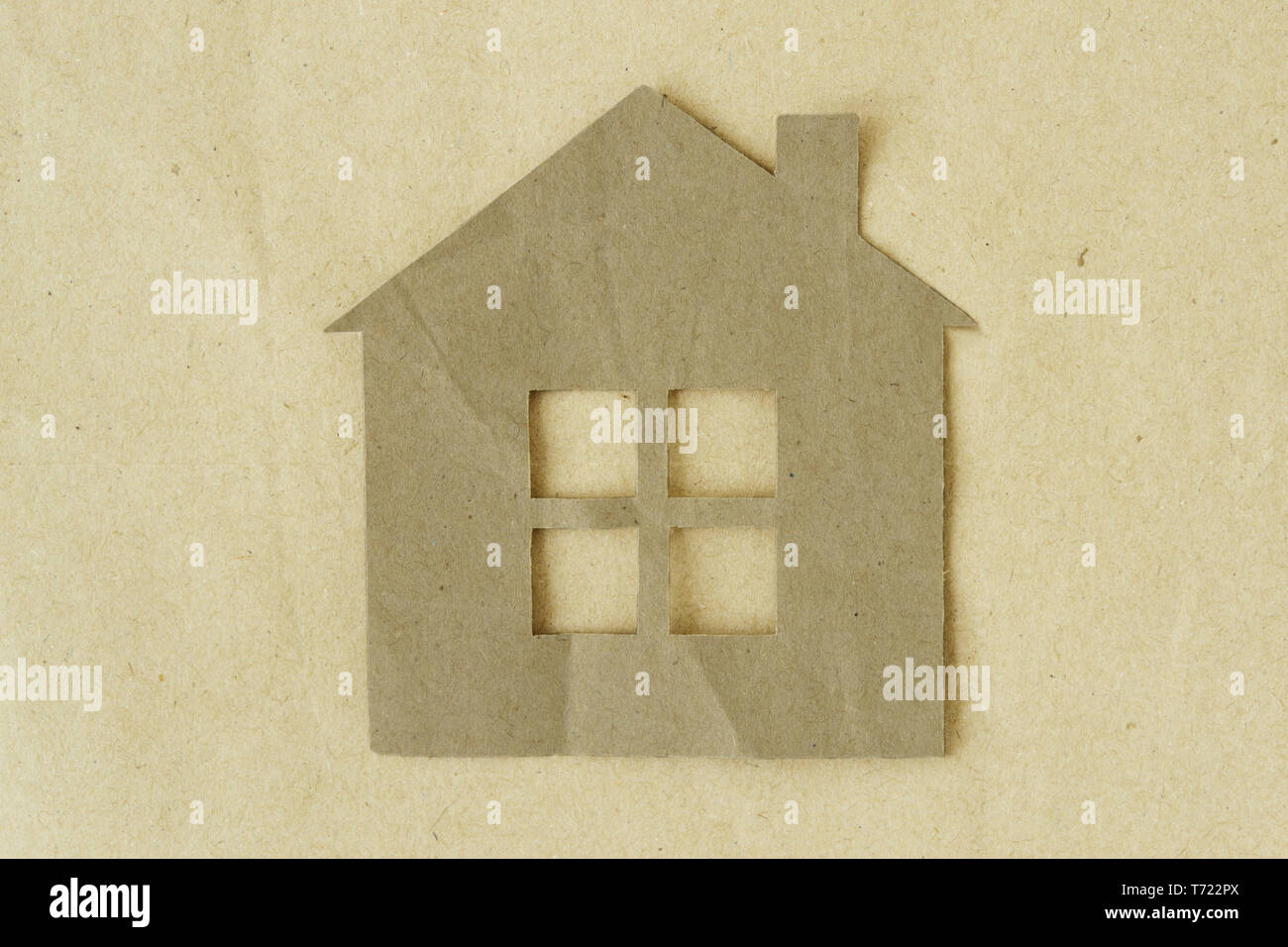 Paper cut of home on recycled paper background - Eco-house concept ...