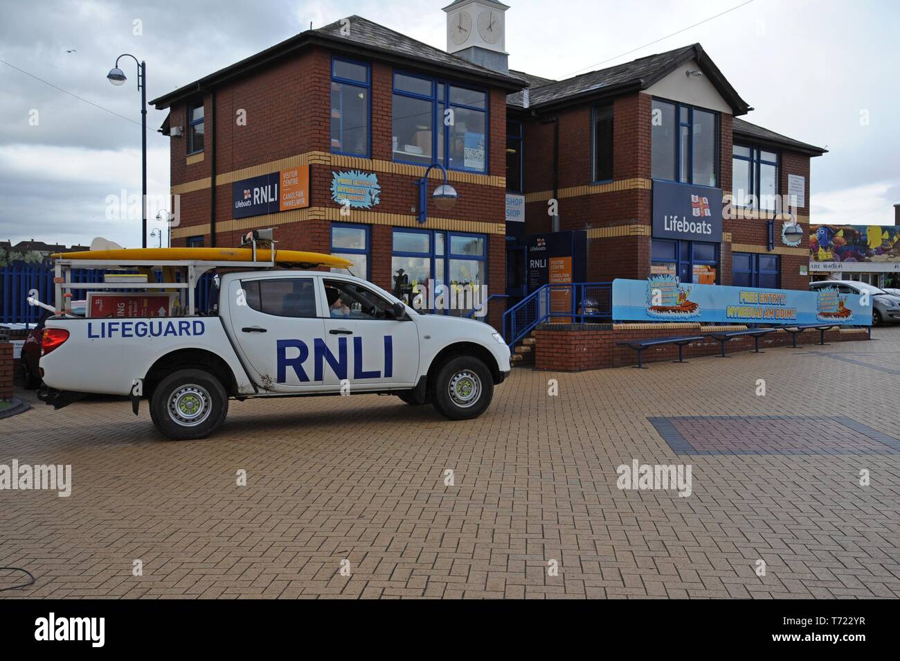 RNLI lifeguards training on the beach and outside the lifeboat station ...