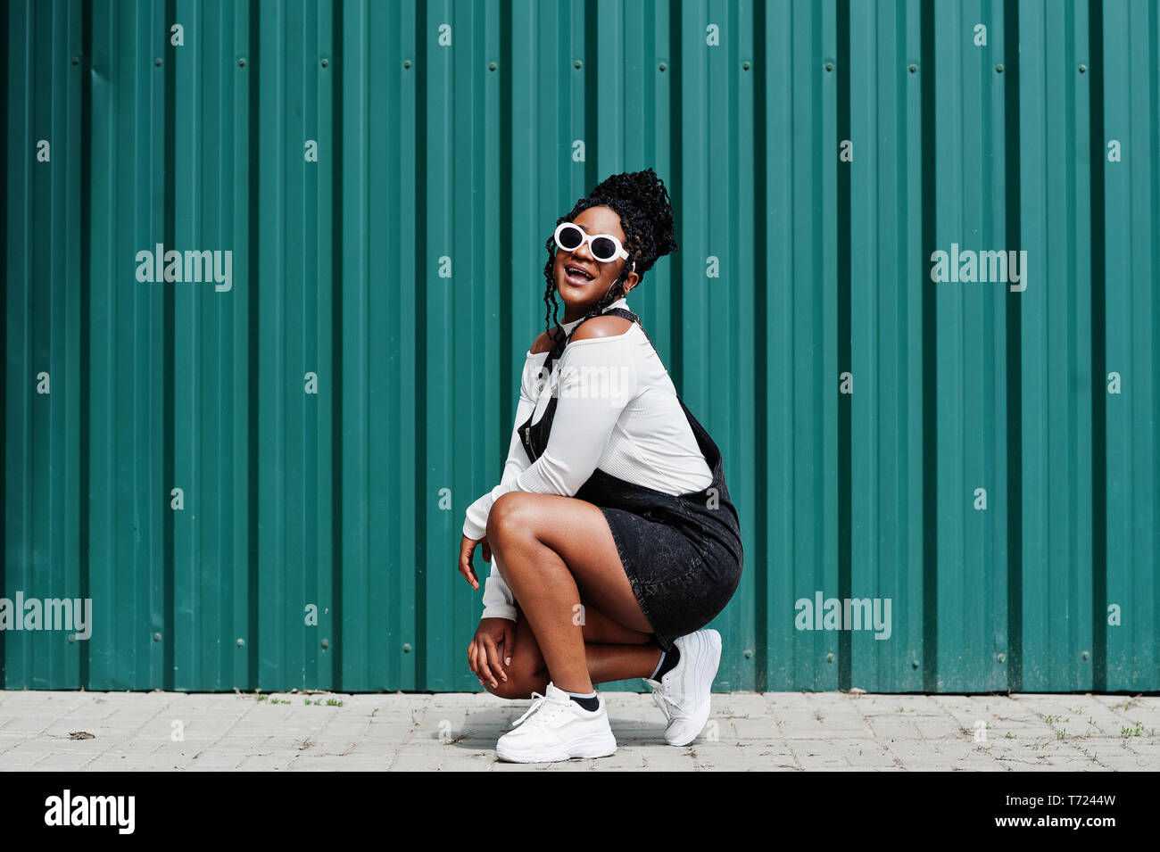 Crouching teen girl one hi-res stock photography and images - Alamy