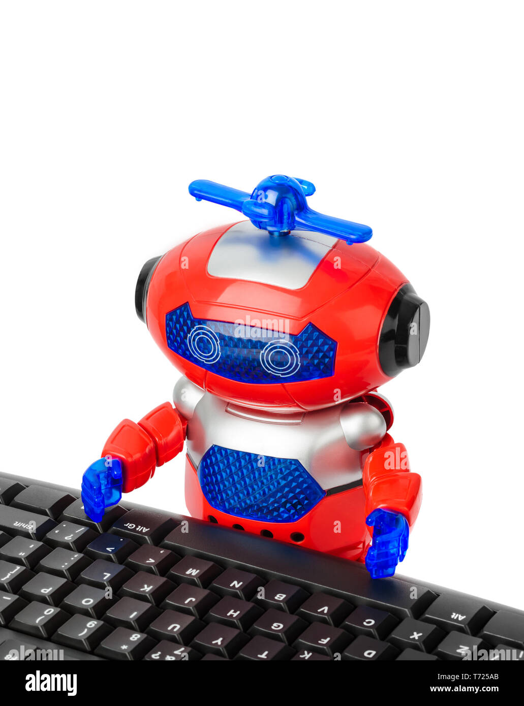 Toy robot and computer Stock Photo - Alamy