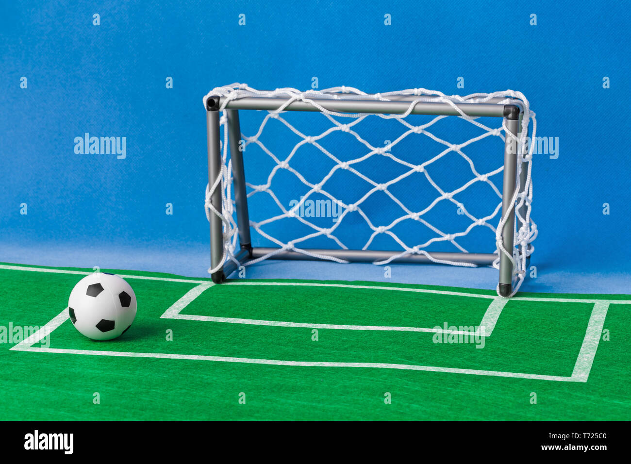 Toy football field and gate Stock Photo - Alamy