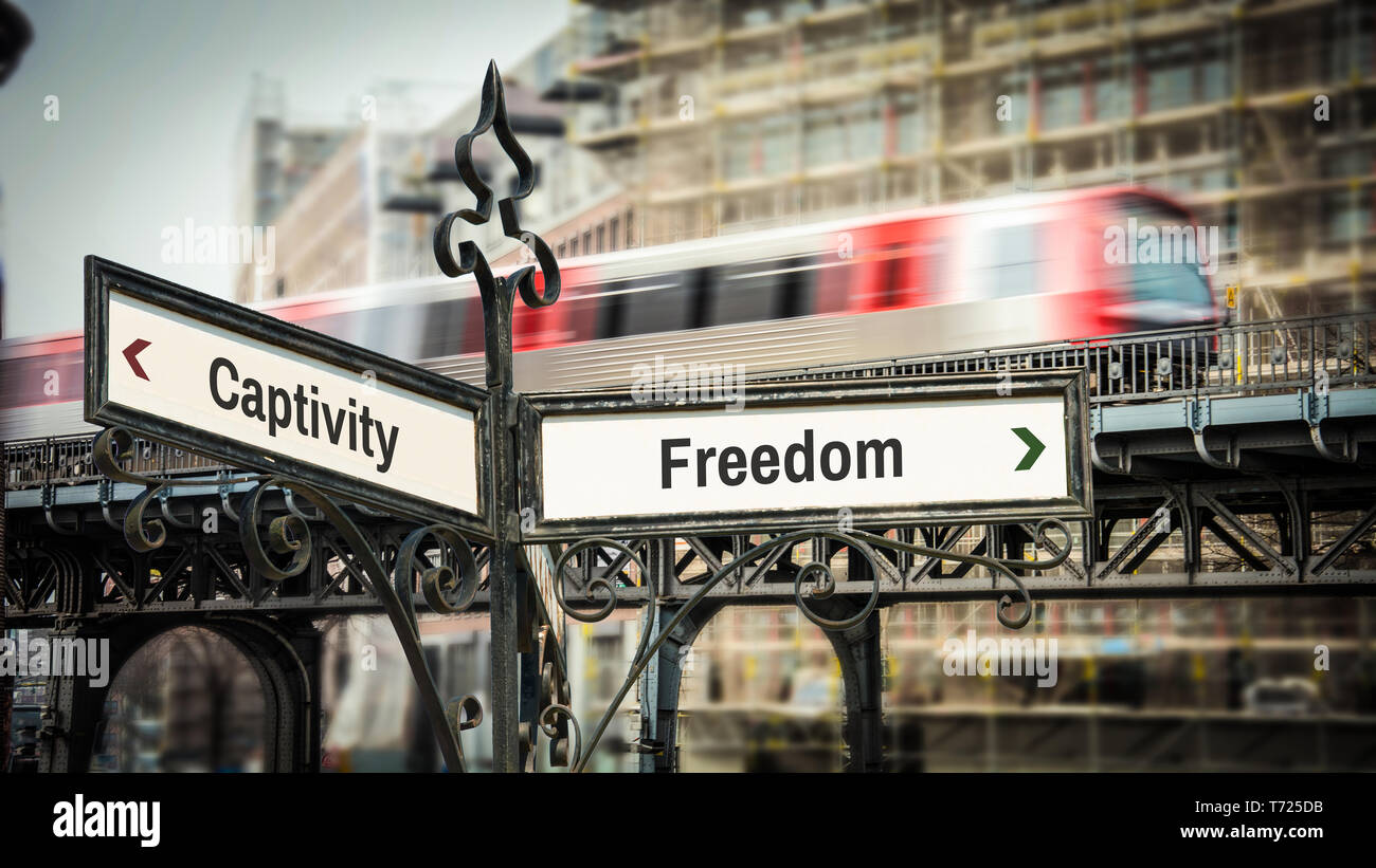 Street Sign the Direction Way to Freedom versus Captivity Stock Photo ...