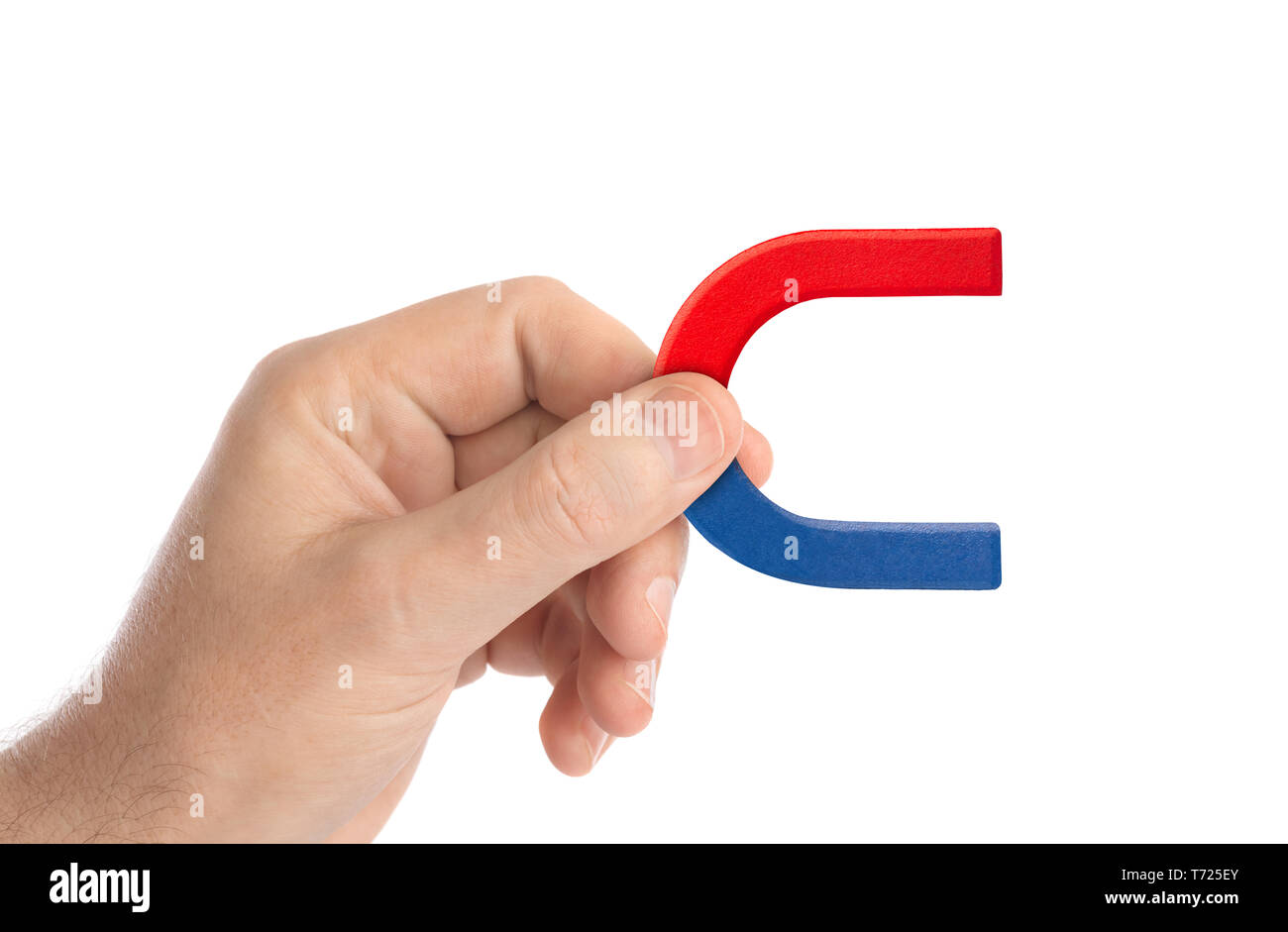 Hand with magnet Stock Photo - Alamy