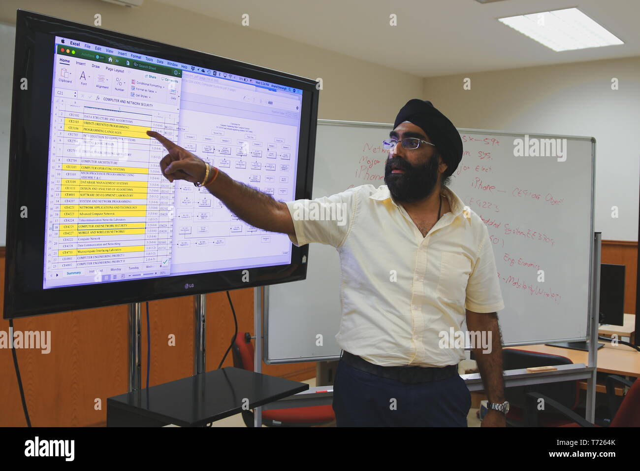 Lecturer at Assumption University (ABAC) teaching a group of computer ...