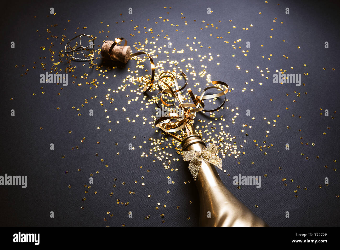 golden champagne on black background Stock Photo - Alamy