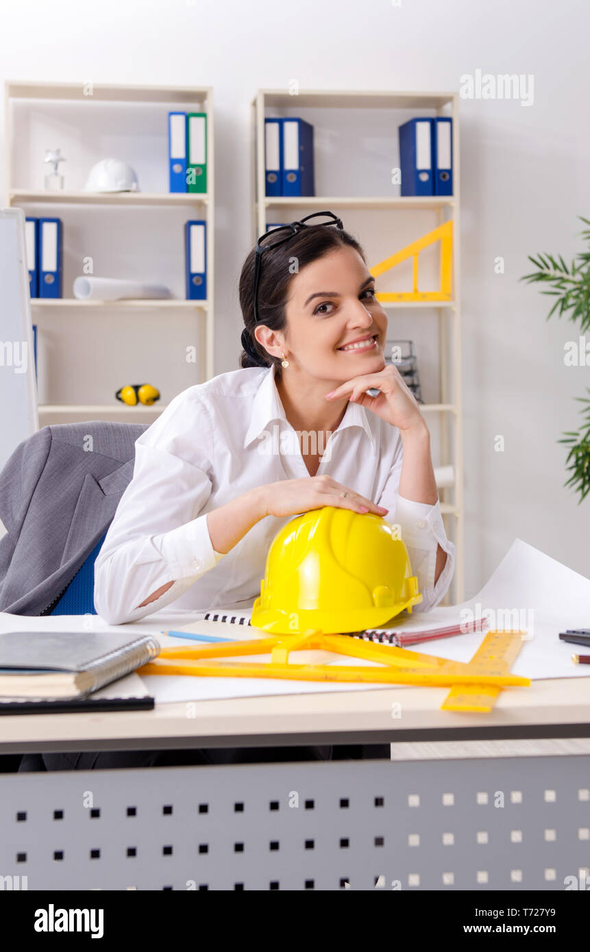 Female architect working in the office Stock Photo - Alamy