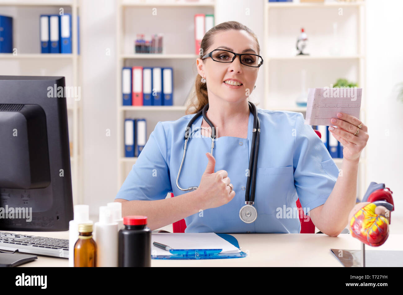 Female doctor cardiologist working in the clinic Stock Photo - Alamy