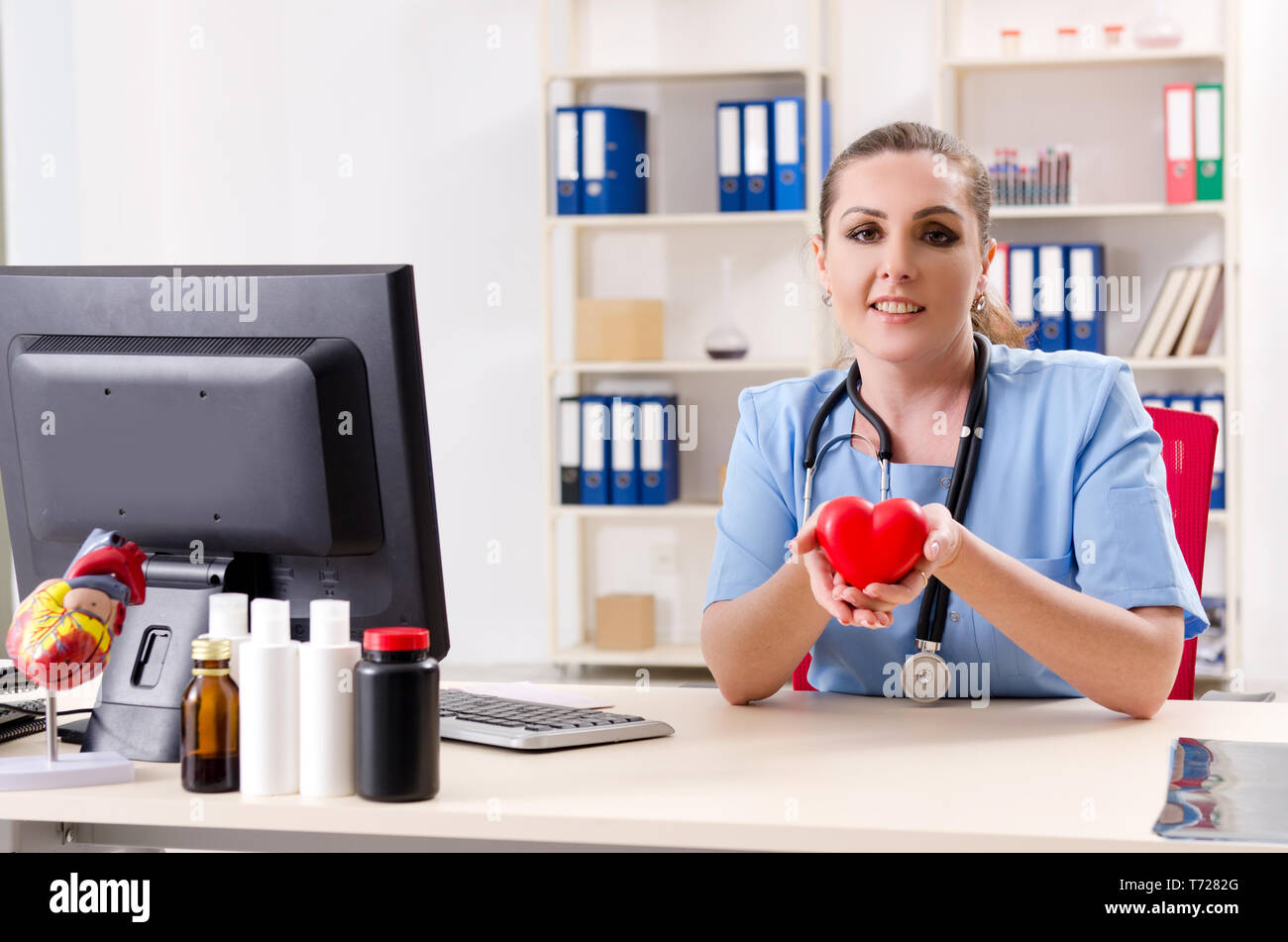 Female doctor cardiologist working in the clinic Stock Photo - Alamy