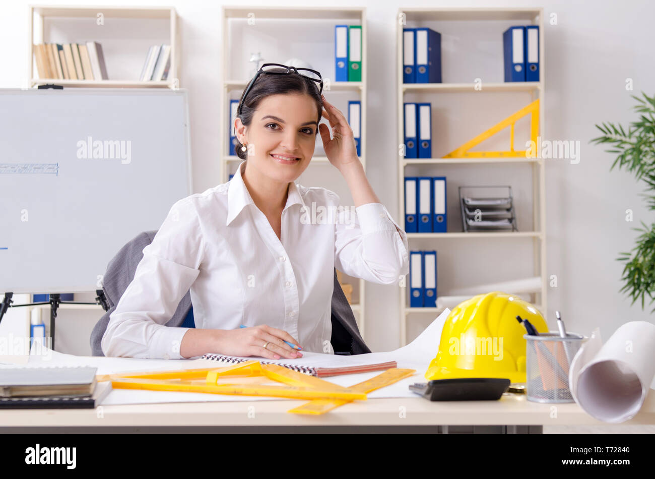 Female architect working in the office Stock Photo - Alamy