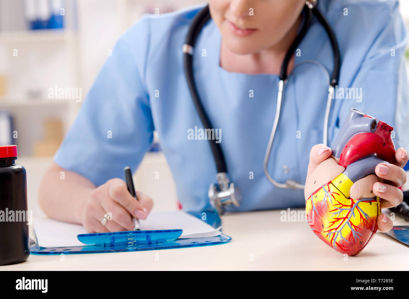Female doctor cardiologist working in the clinic Stock Photo - Alamy