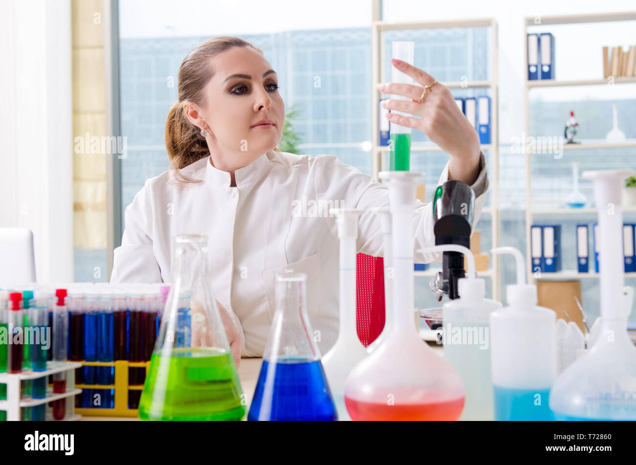 Female chemist working in medical lab Stock Photo - Alamy