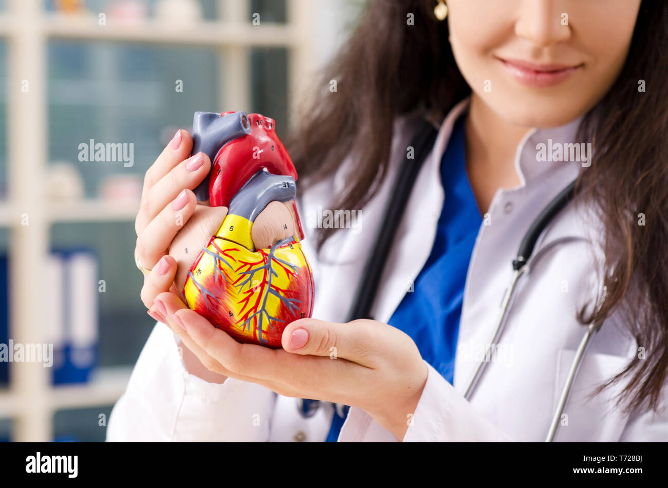Female doctor cardiologist working in the clinic Stock Photo - Alamy