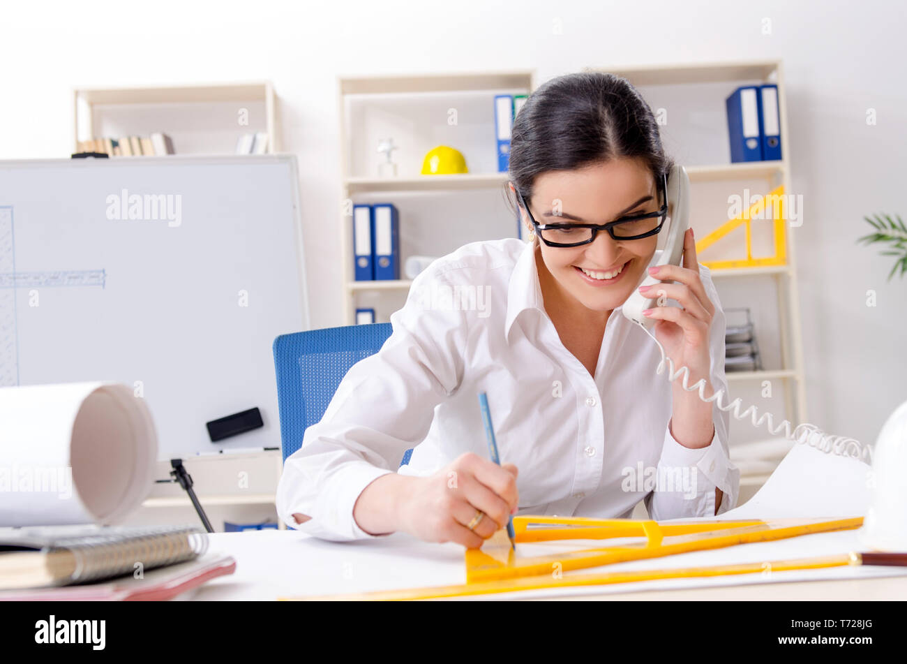 Female architect working in the office Stock Photo - Alamy