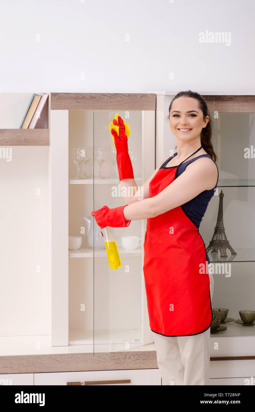 Excited cleaning young woman hi-res stock photography and images - Alamy