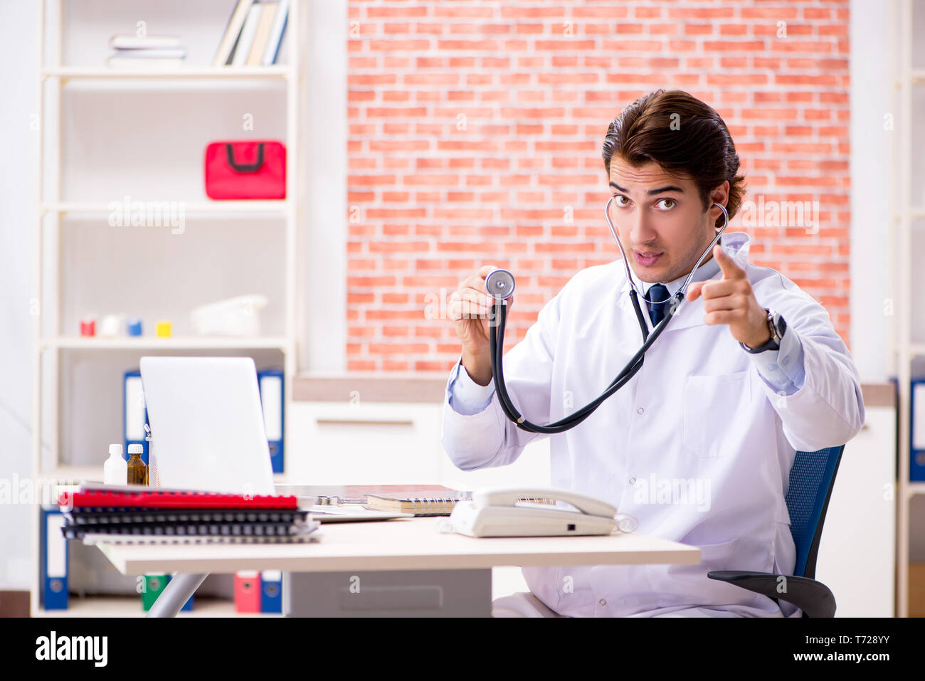 Young doctor working in hospital Stock Photo - Alamy