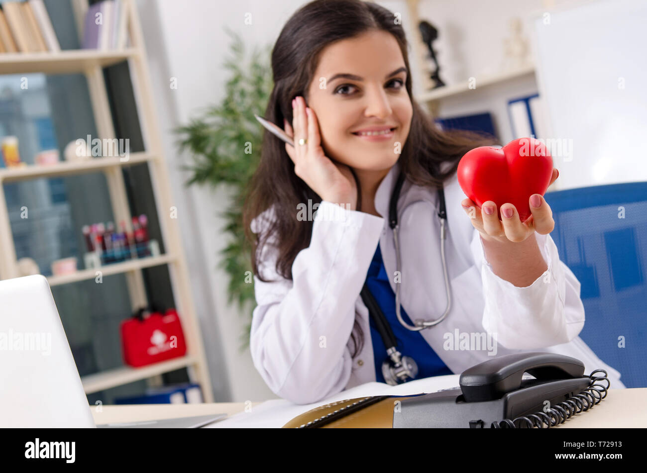Female doctor cardiologist working in the clinic Stock Photo - Alamy