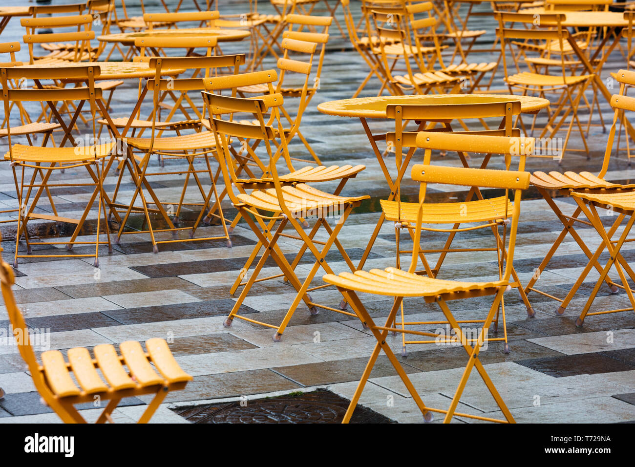 yellow tables and chairs in a cafe Stock Photo - Alamy