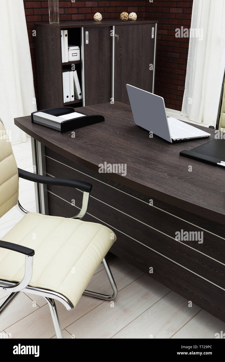 laptop on desk in modern office Stock Photo - Alamy
