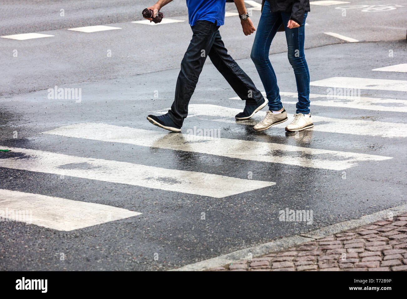 Man walking across crosswalk hi-res stock photography and images - Alamy