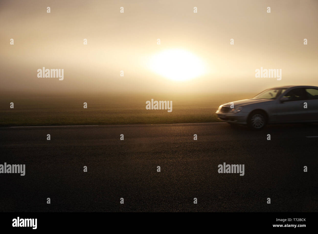 Business person driving to work at sun rise Stock Photo - Alamy