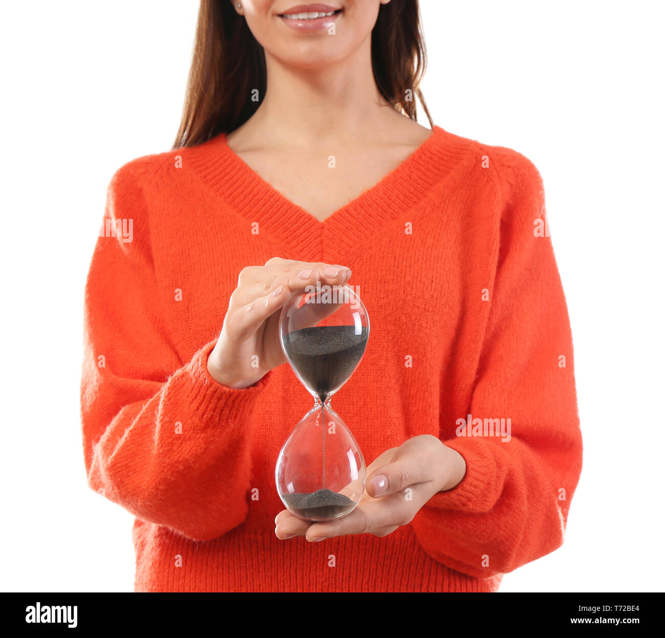 Woman holding hourglass on white background. Time management concept ...