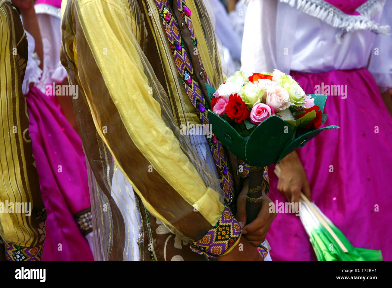Photo of colorful costumes, attire and props of parade participants ...