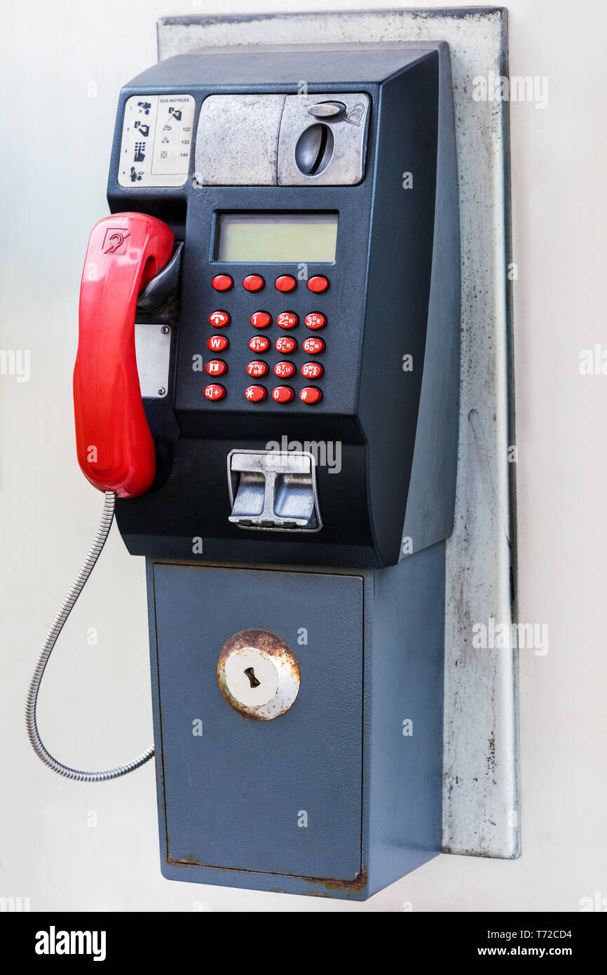 public telephone on city street Stock Photo - Alamy