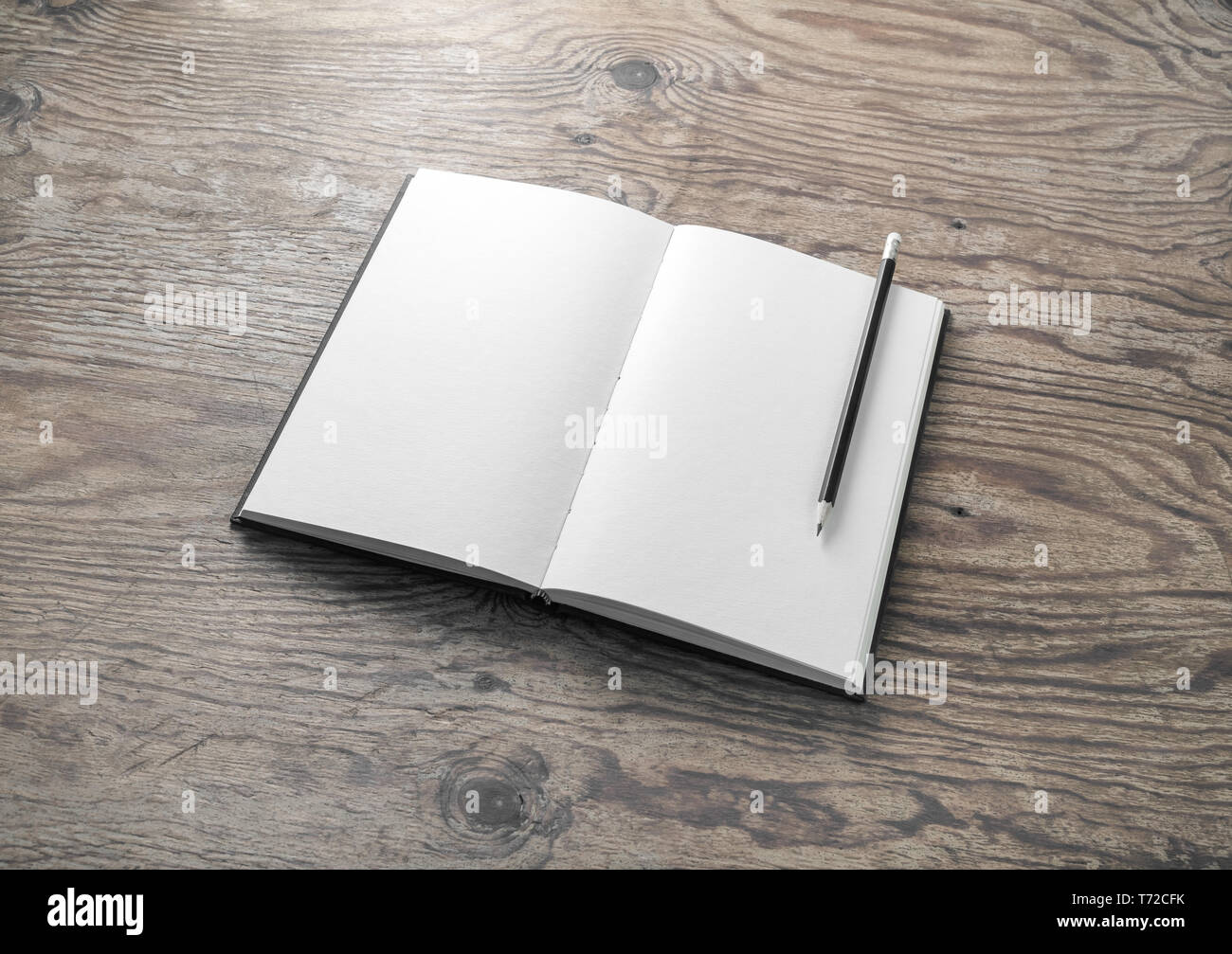 Book and pencil Stock Photo - Alamy