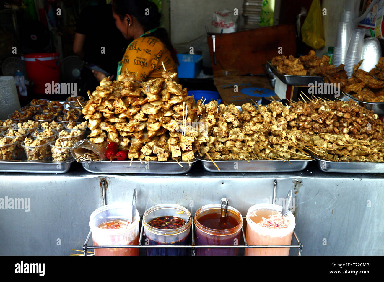ANTIPOLO CITY, PHILIPPINES - MAY 1, 2019: Food vendors sells deep fried ...