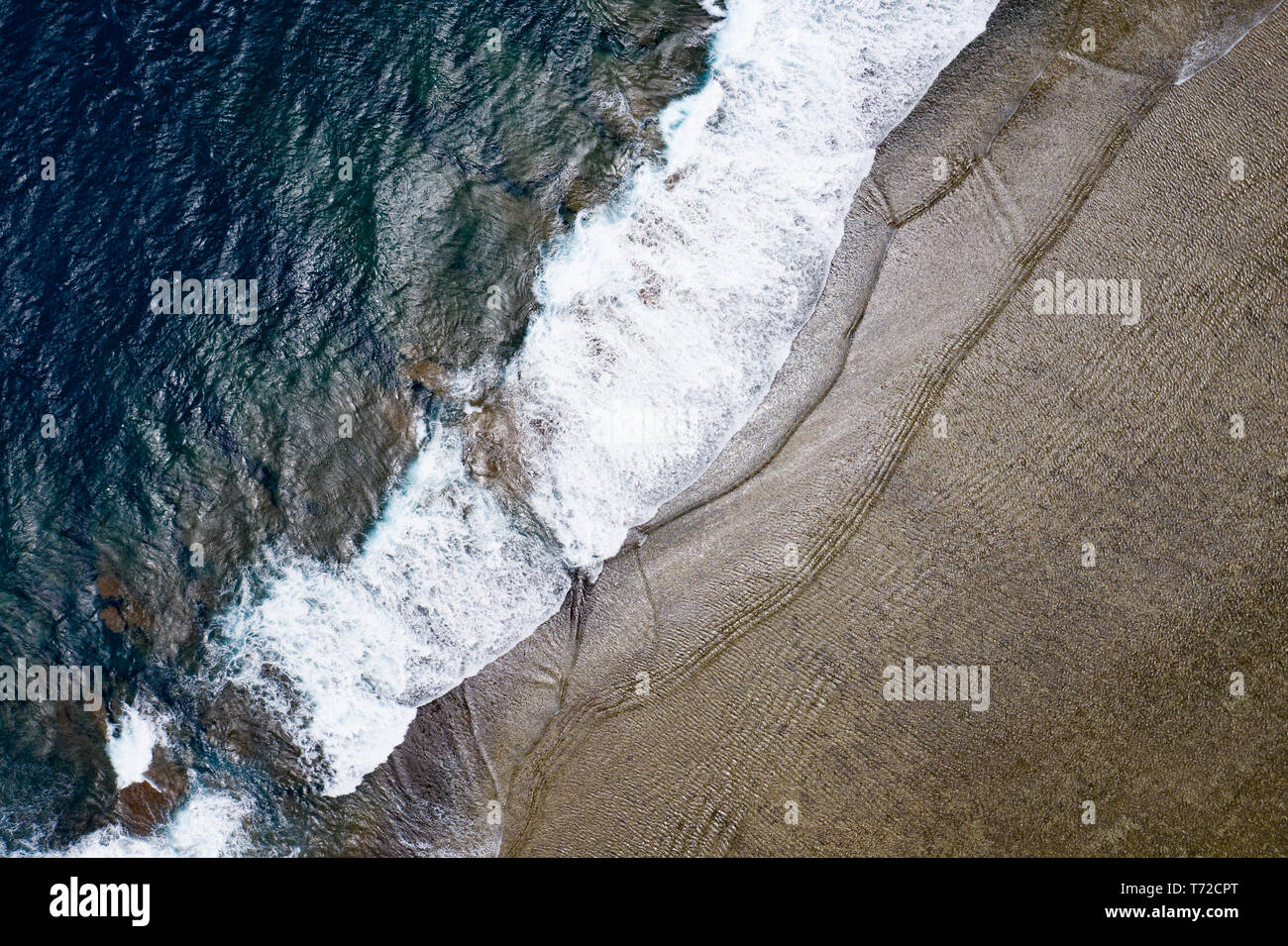 Waves from the pacific ocean crashing against the breakwater at ...