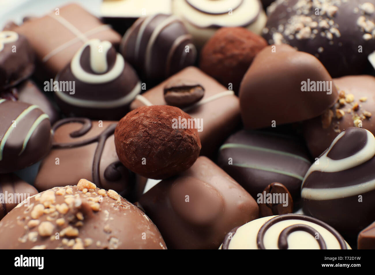 Different tasty chocolate candies, closeup Stock Photo - Alamy