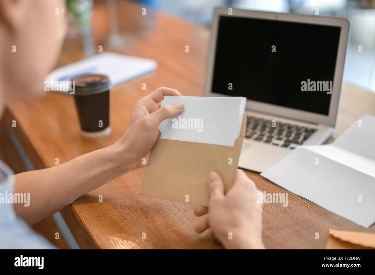 Man hands opening mail hi-res stock photography and images - Alamy