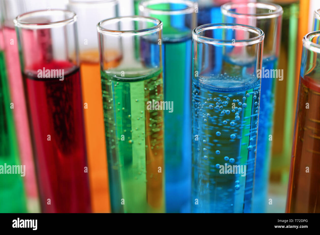 Many test tubes with colorful liquids, closeup Stock Photo - Alamy