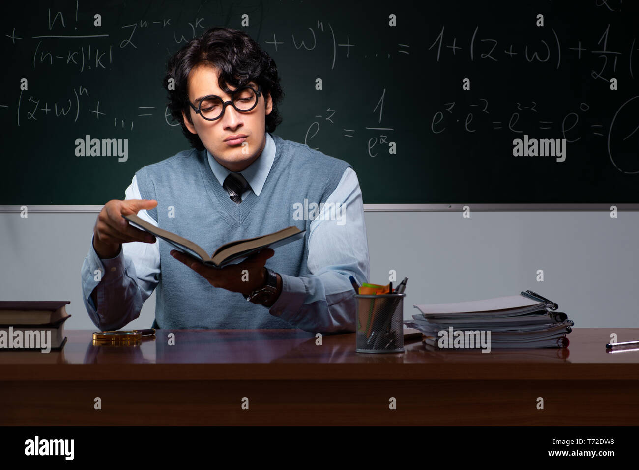 Man in front of blackboard math hi-res stock photography and images - Alamy