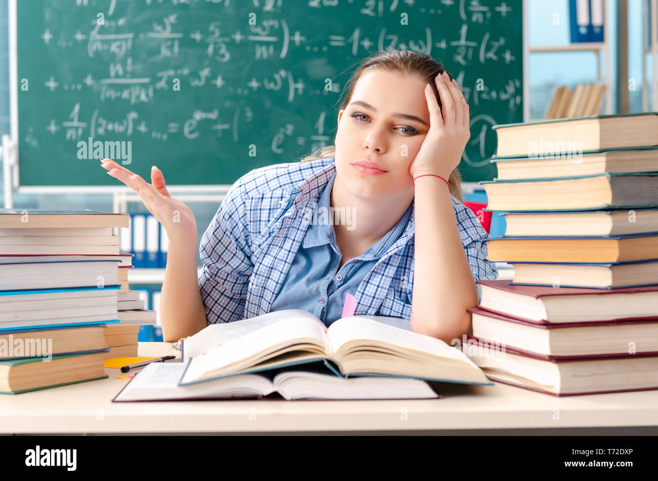 Girl many books school hi-res stock photography and images - Alamy