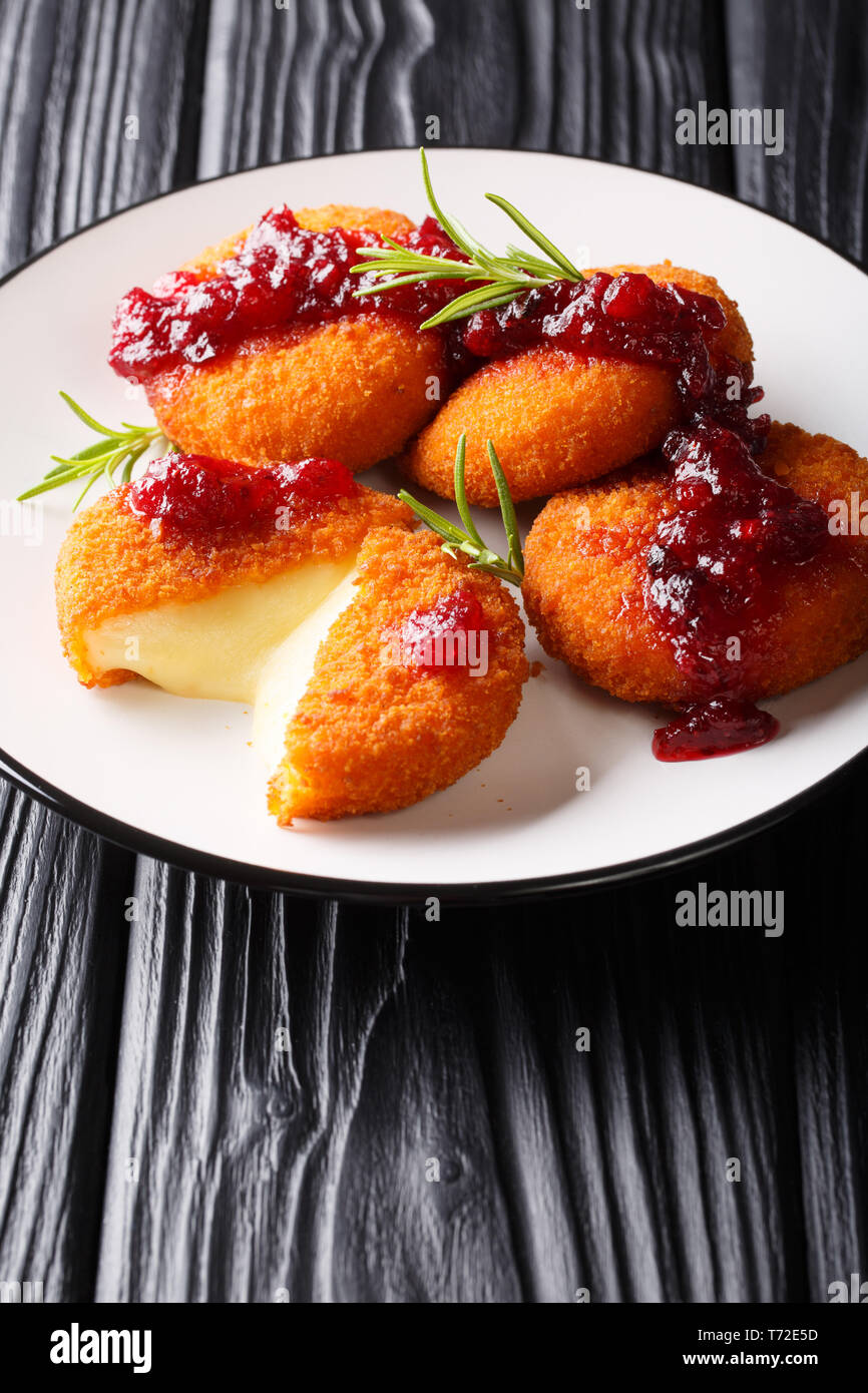 Hot Camembert cheese in breading served with cranberry sauce and ...