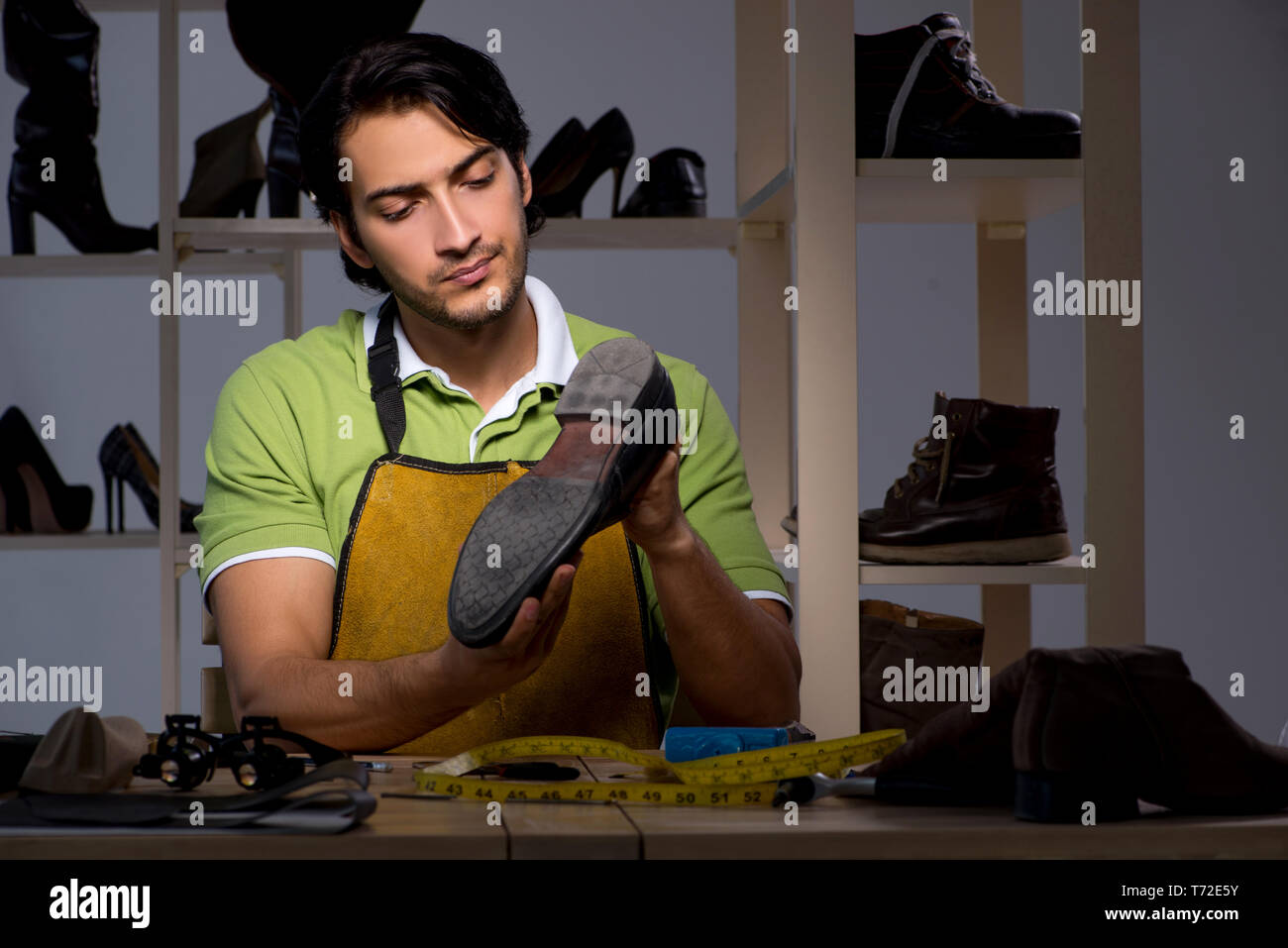 Young shoemaker in shoe hi-res stock photography and images - Alamy