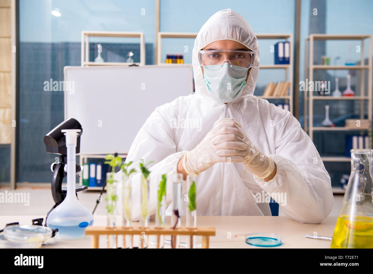Male biotechnology scientist chemist working in the lab Stock Photo - Alamy