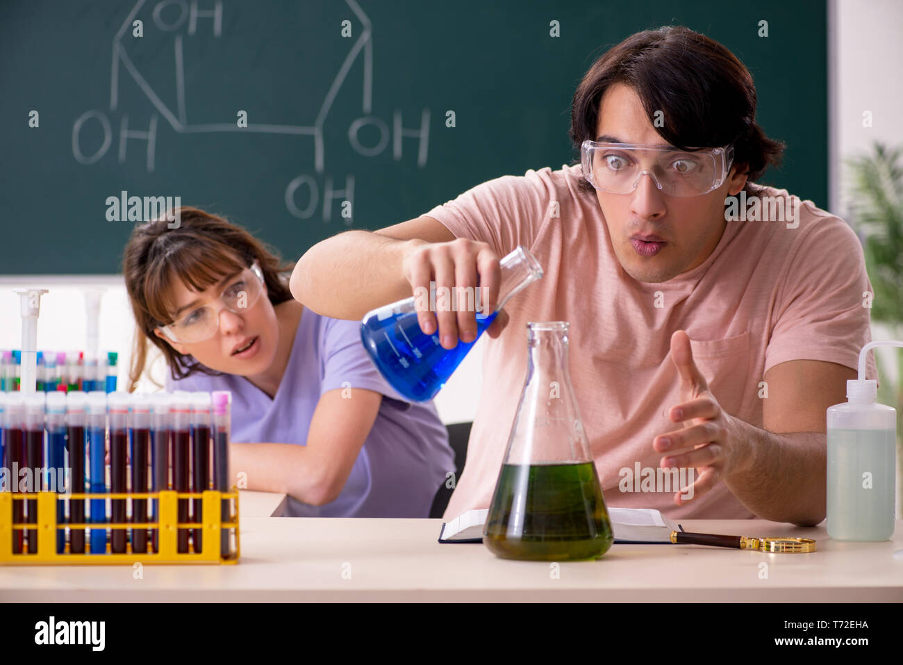 Two chemists students in classroom Stock Photo - Alamy