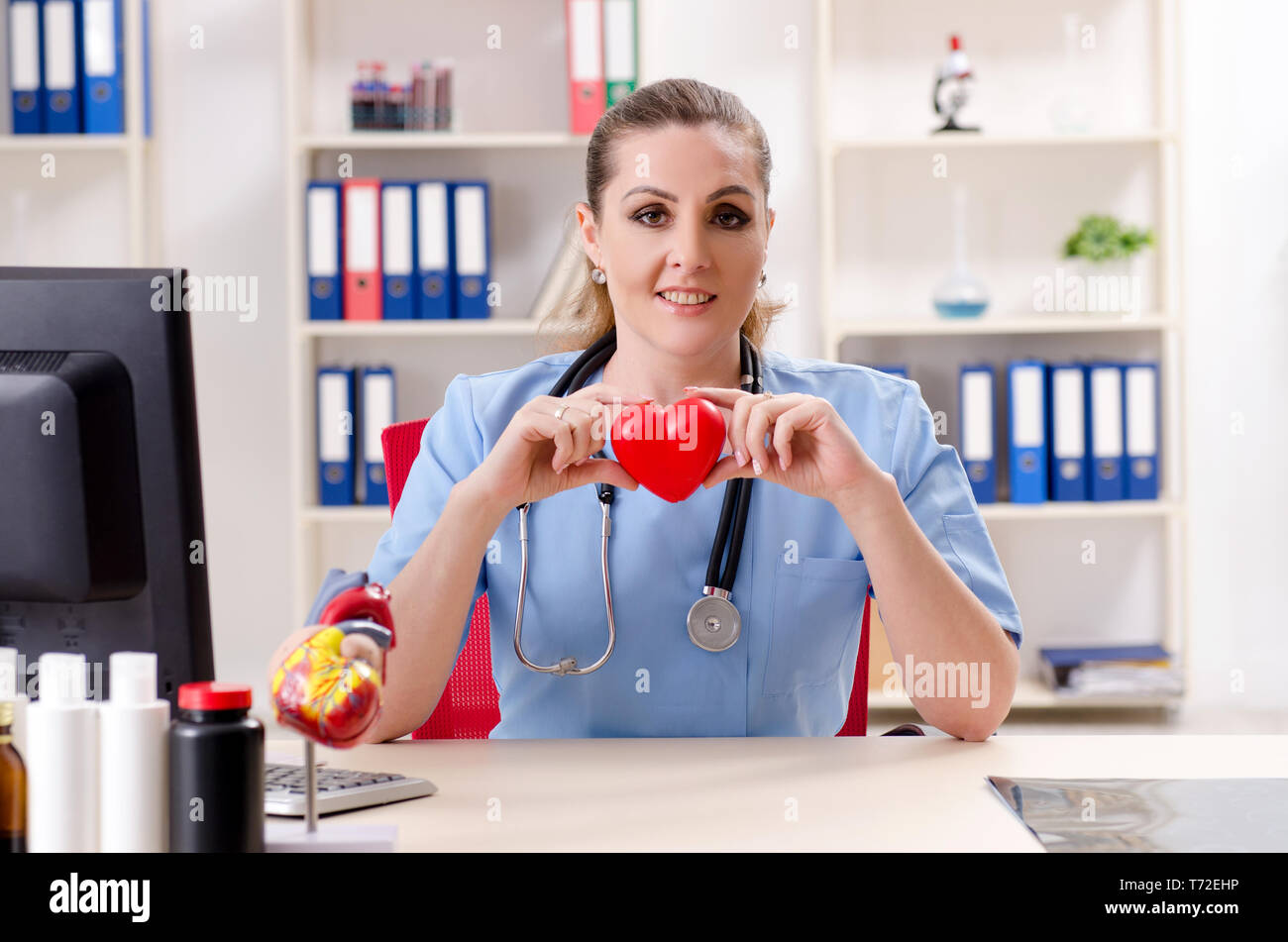 Female doctor cardiologist working in the clinic Stock Photo - Alamy