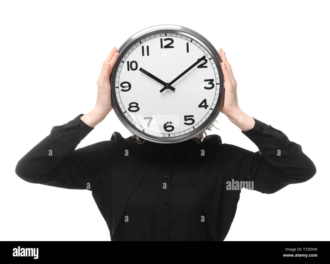 Woman hiding face behind clock on white background. Time management ...