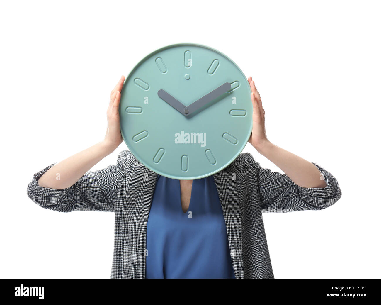 Woman hiding face behind clock on white background. Time management ...